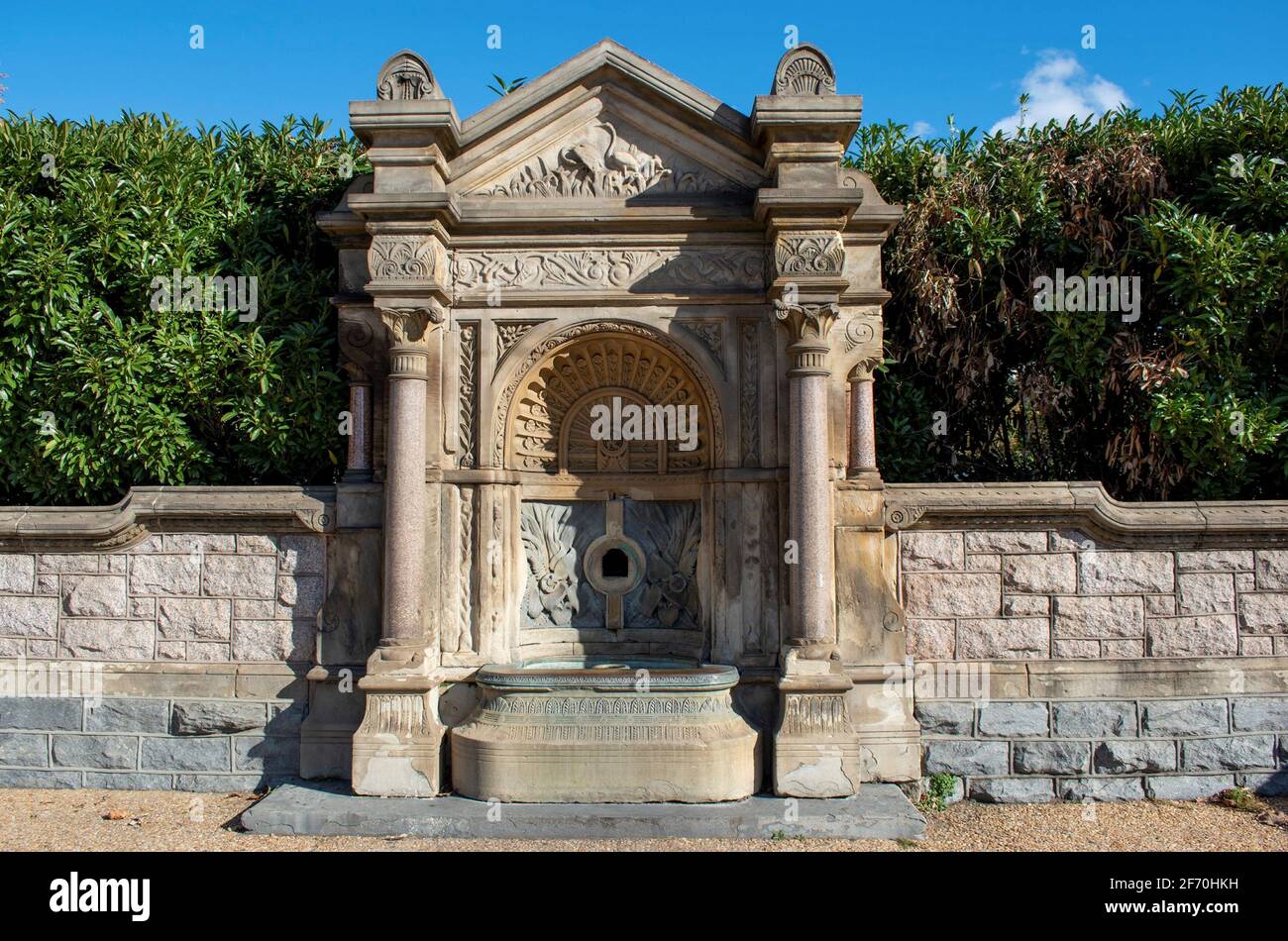 antique water fountain with beautiful roman style carving and colored ...