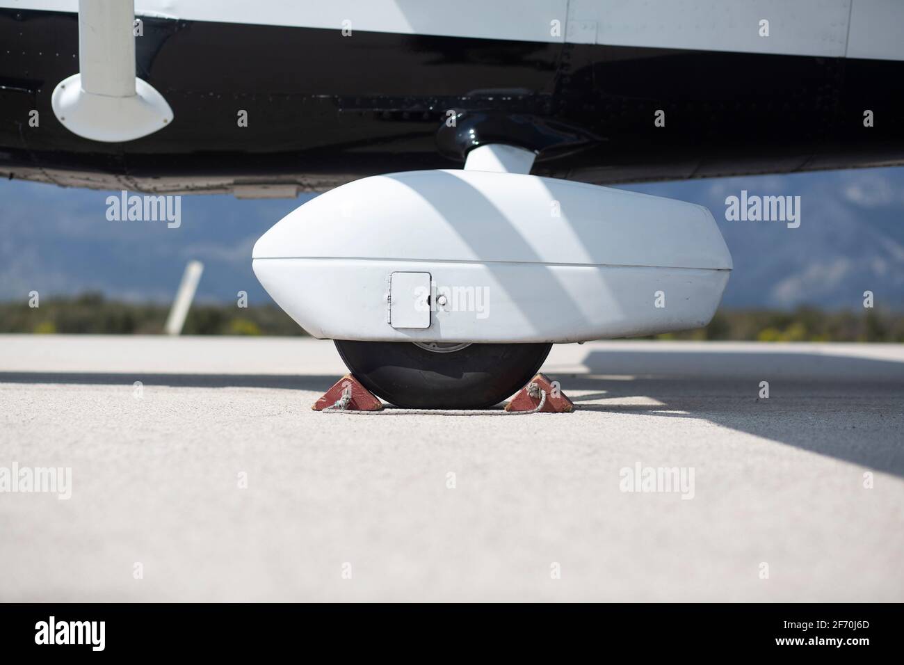 Chocked wheel view of a small airplane in Turkey Stock Photo - Alamy