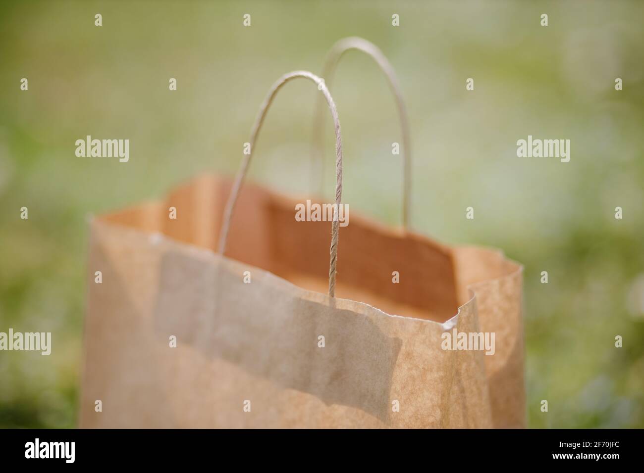 eco paper bag on grass outdoors Stock Photo - Alamy