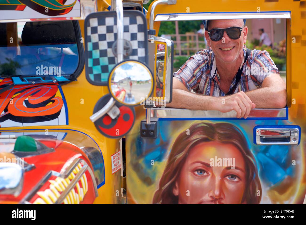 Independent Western travel correspondent stands at the door to a ...