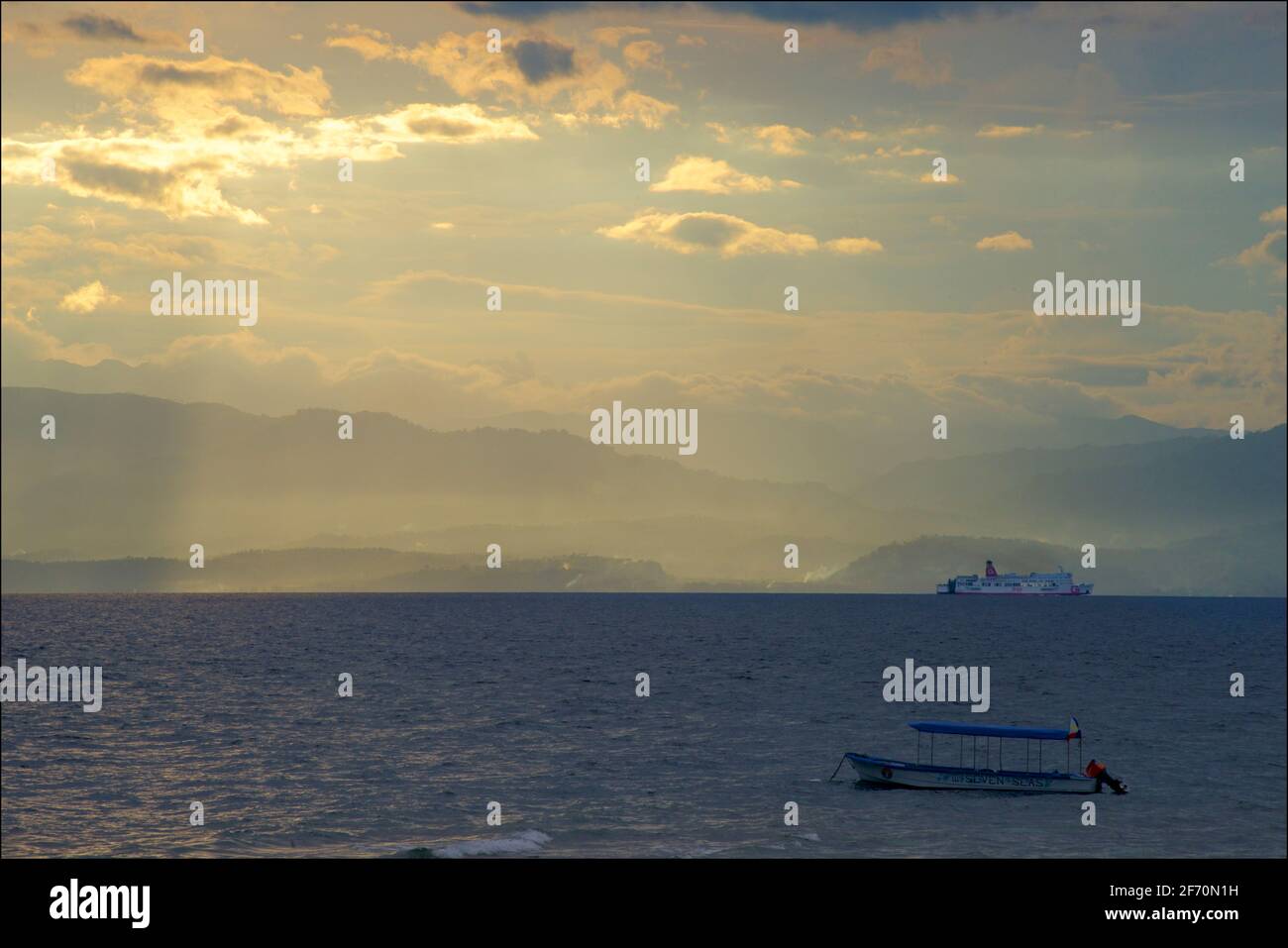 View across the Ta–on straits from Moalboal to Negros Island. A ferry ...