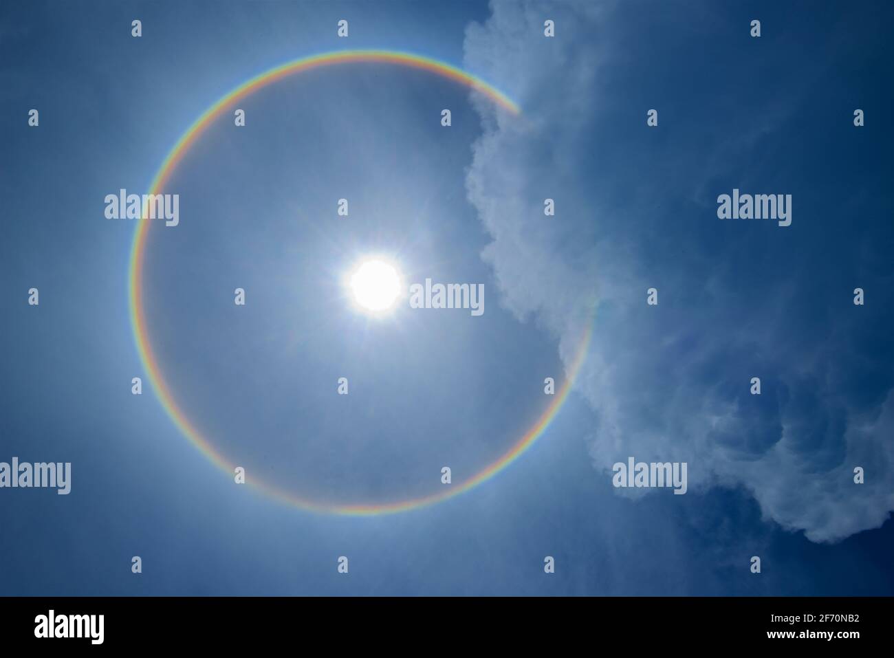 A solar halo or sundog in a Filipino sky. The Philippines Stock Photo ...