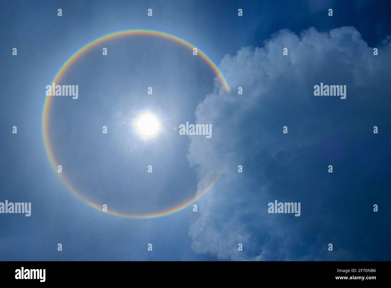 A solar halo or sundog in a Filipino sky. The Philippines Stock Photo ...