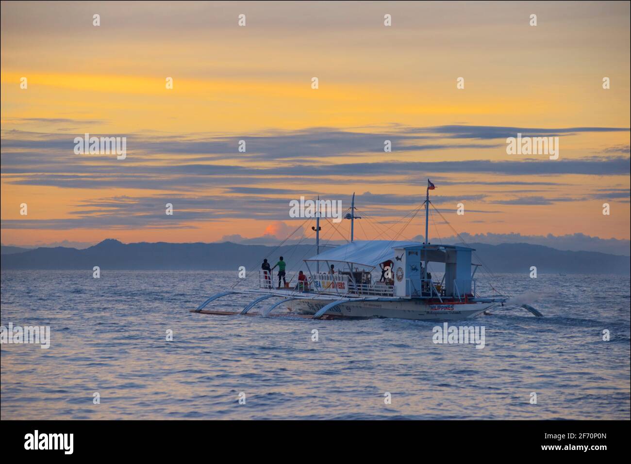 Visayan Sea off Malapascua Island, Philippines. Diveboat returning from ...
