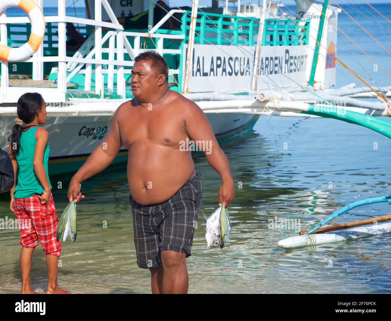 Filipino man with a fresh catch of fish. Logon, Malapascua Island, Cebu ...