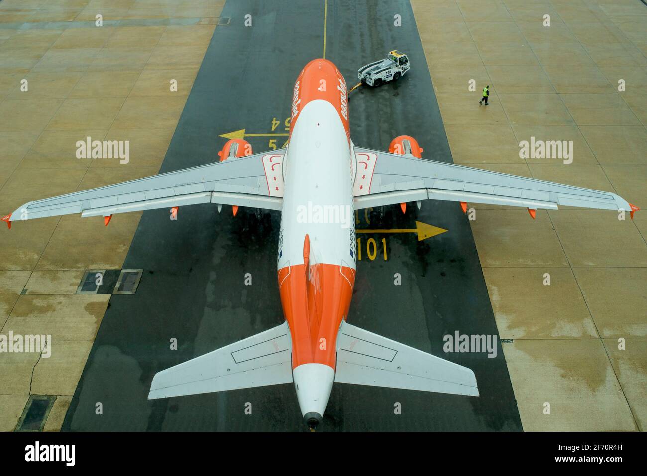 Aerial perspective of aircraft taxi-ing on runway. Easyjet. Gatwick ...