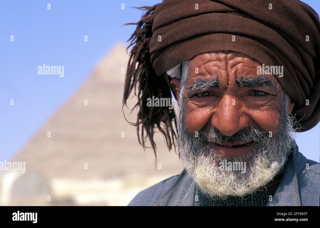 Local Egyptian 'guide' in front of the Khephren pyramid, Giza, Egypt ...