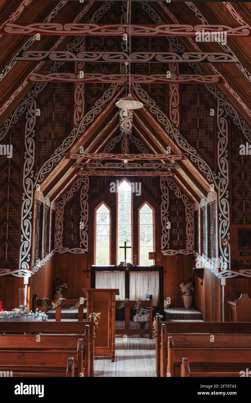 inside an ornate historic Anglican Māori church, lined with kowhaiwhai ...