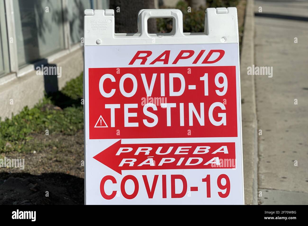 A Rapid COVID-19 Testing sign in English and Spanish at Via Care LA ...