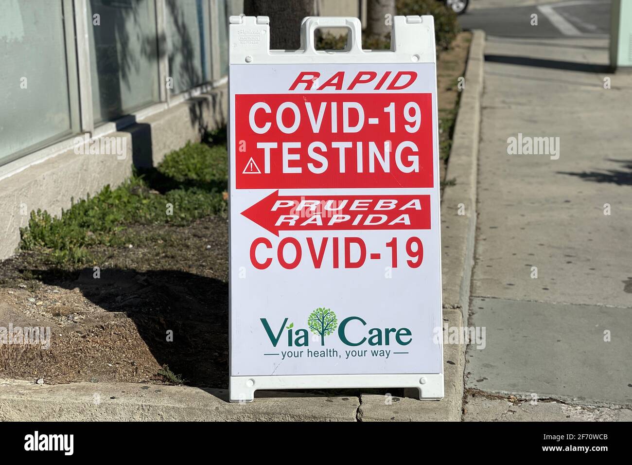 A Rapid COVID-19 Testing sign in English and Spanish at Via Care LA ...