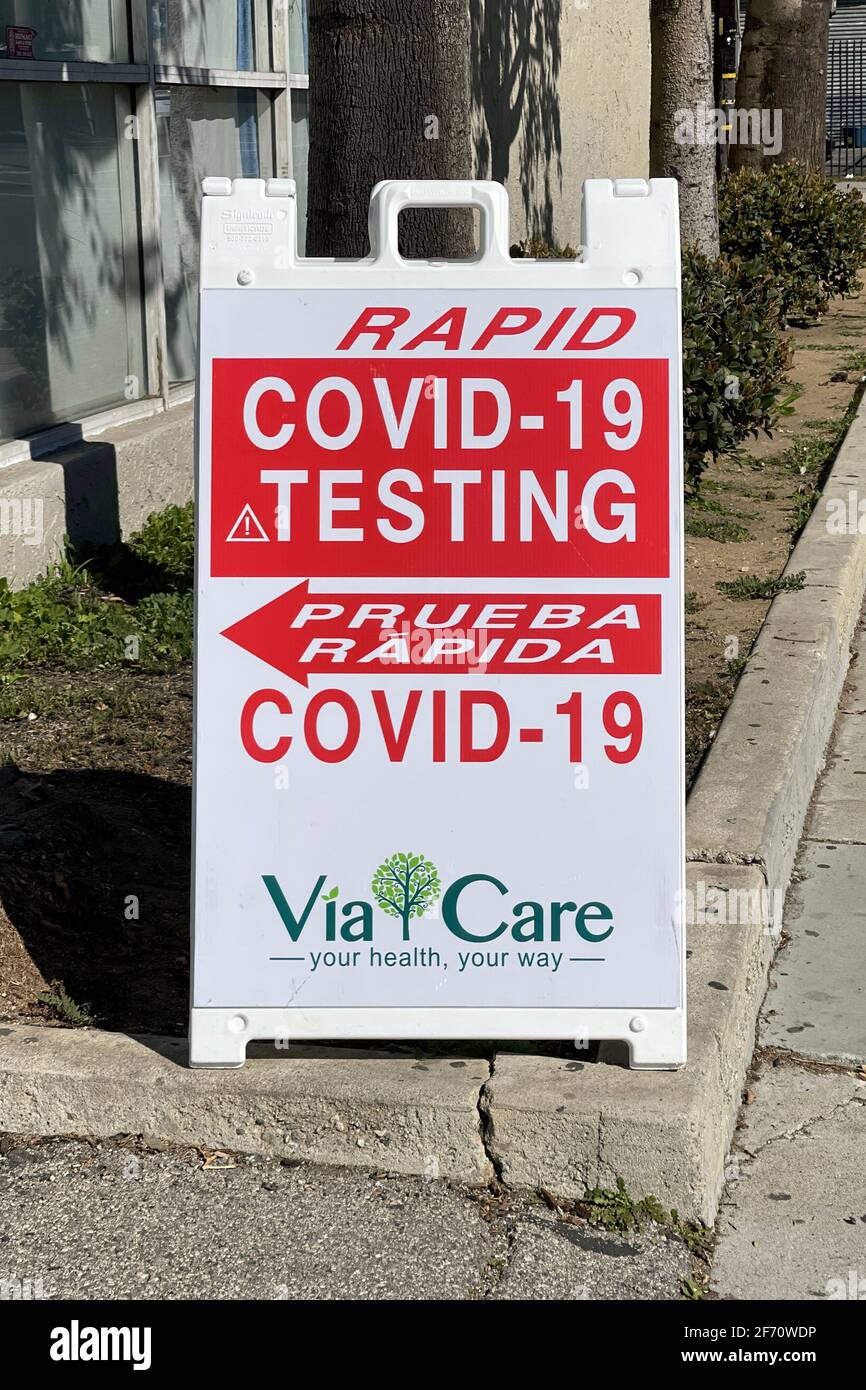 A Rapid COVID-19 Testing sign in English and Spanish at Via Care LA ...