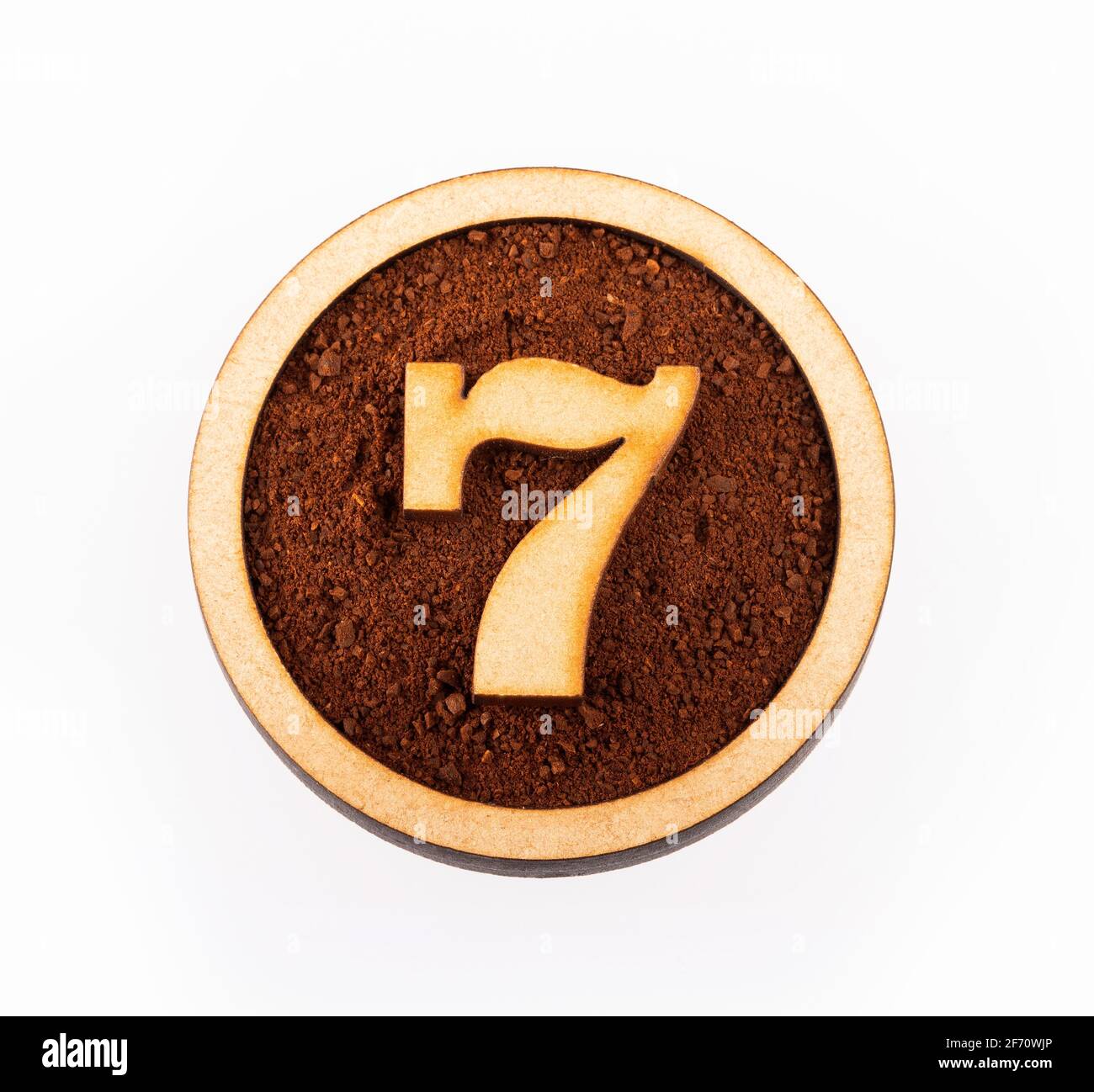 7, Number in wood - Ground organic coffee. Coffea Stock Photo - Alamy