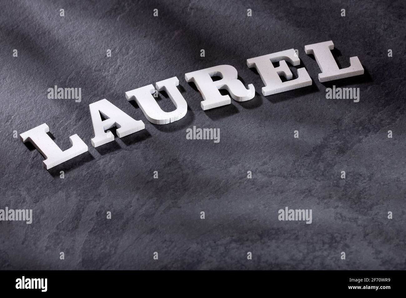 Laurus nobilis - Laurel word in wooden letters Stock Photo - Alamy