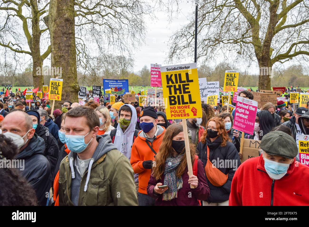 Protesters hold placards during the demonstration.Thousands of people ...