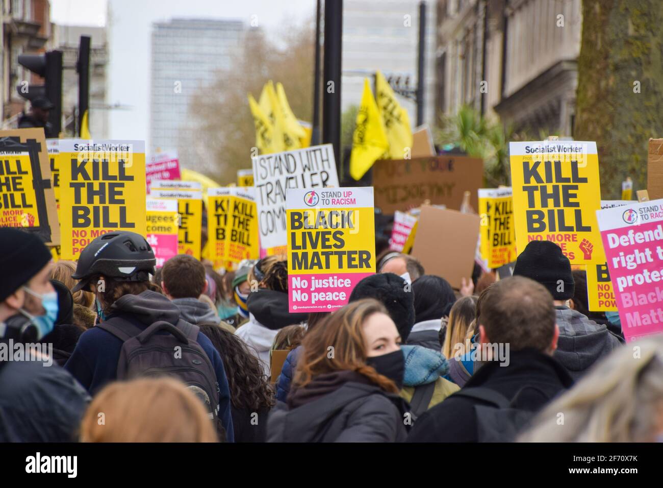 Protesters hold placards during the demonstration.Thousands of people ...