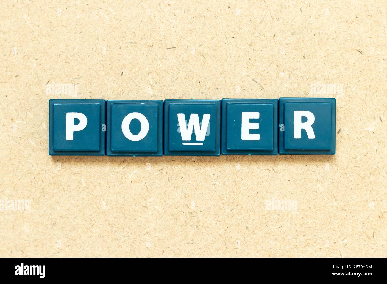 Tile alphabet letter in word power on wood background Stock Photo - Alamy