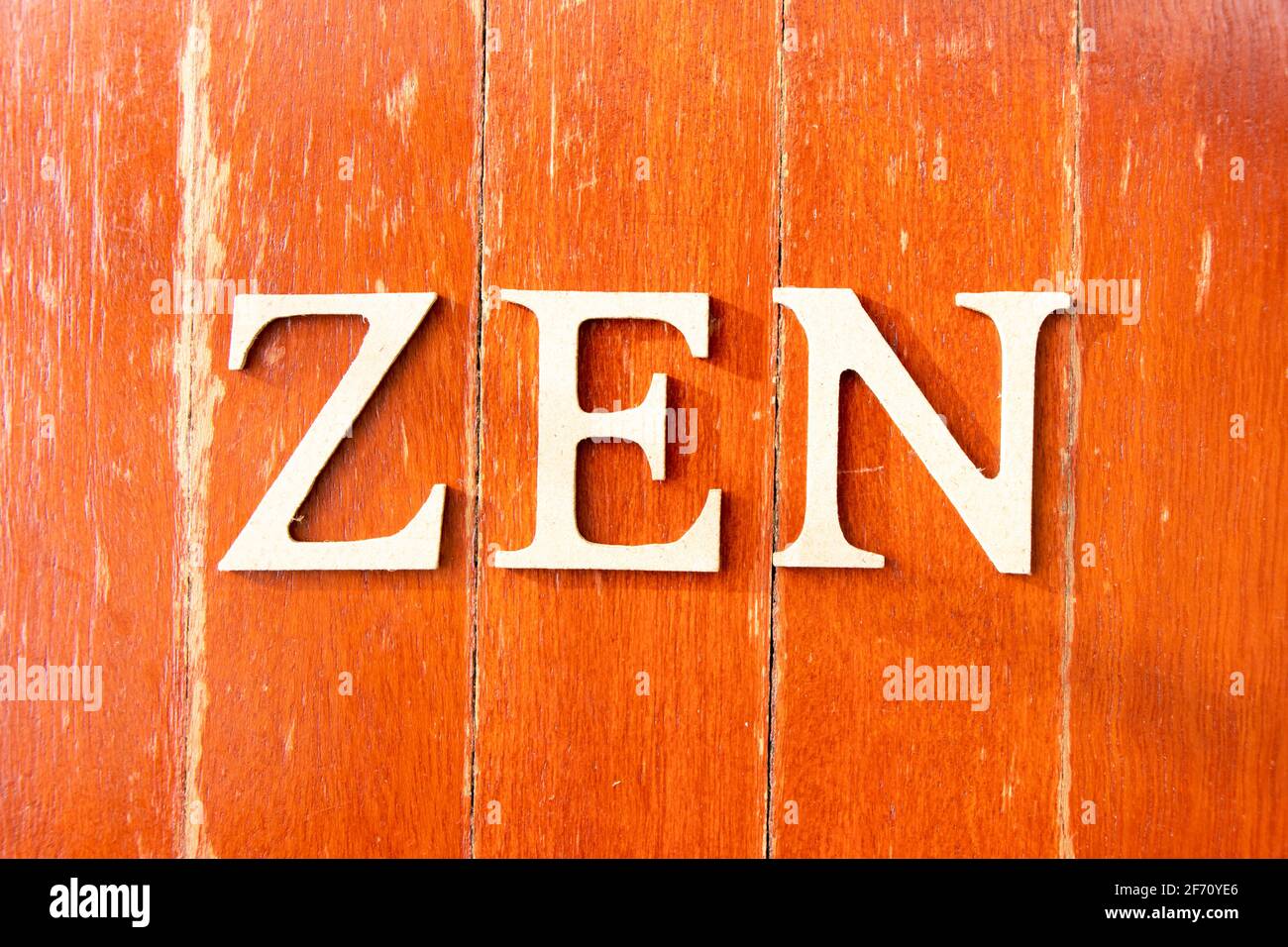 Alphabet letter in word zen on old red color wood plate background ...