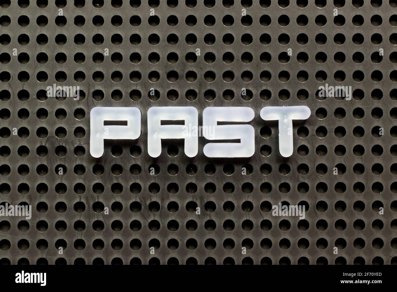 White color letter in word past on black pegboard background Stock ...