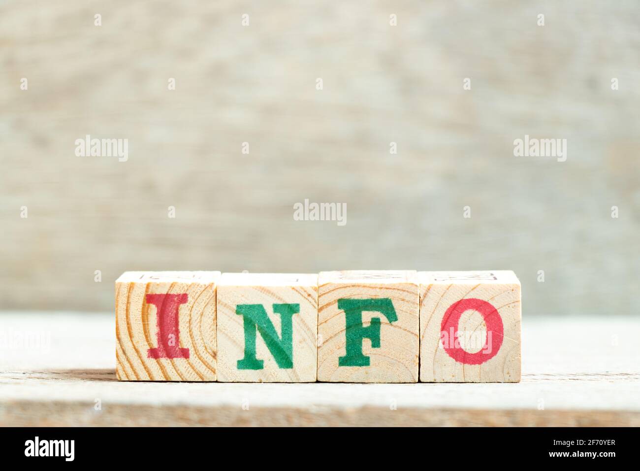 Alphabet letter block in word info on wood background Stock Photo - Alamy