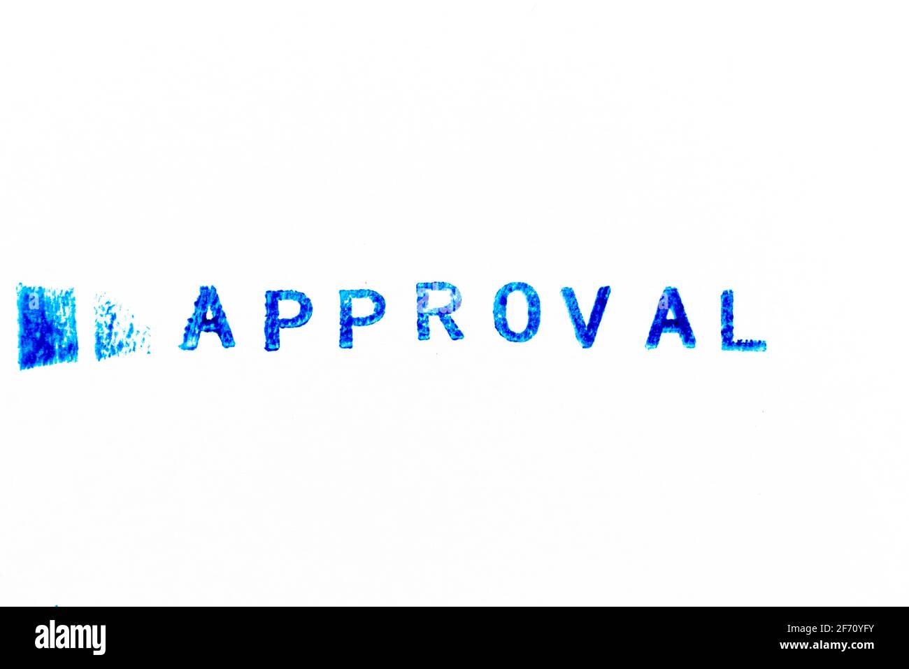 Blue color ink of rubber stamp in word approval on white paper ...