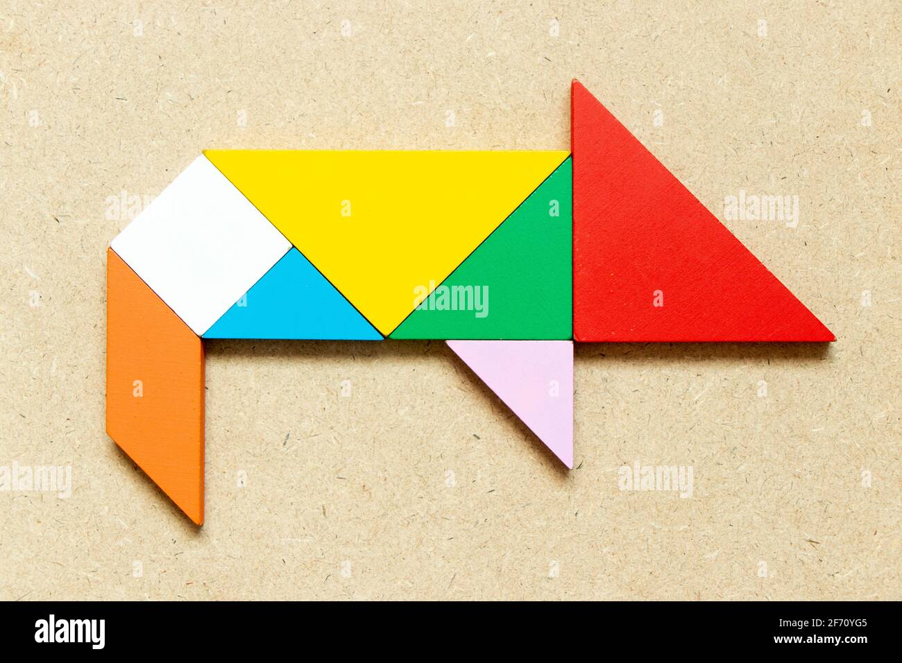 Color tangram puzzle in pig or hog shape on wood background Stock Photo ...