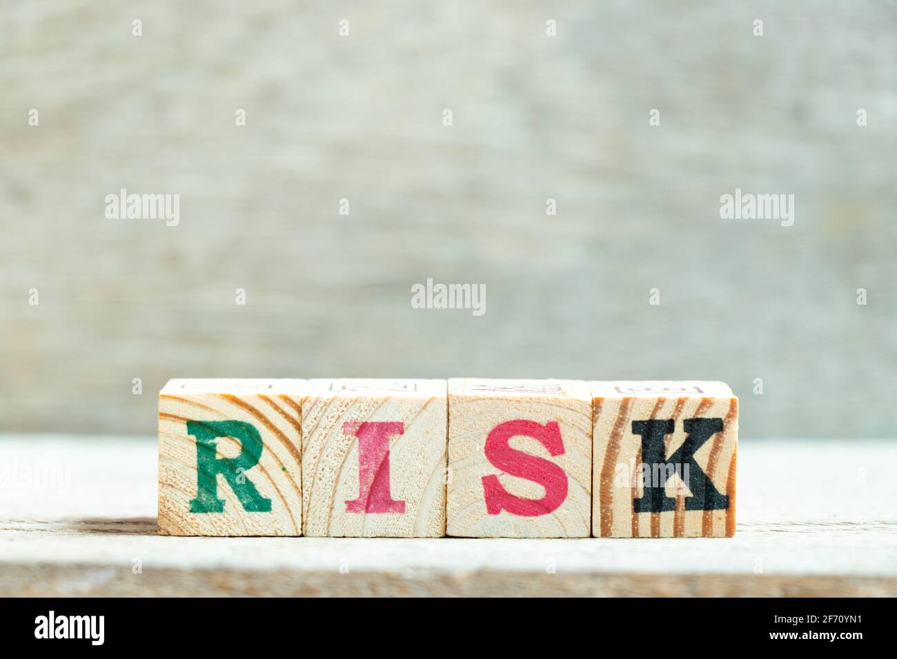 Alphabet letter block in word risk on wood background Stock Photo - Alamy