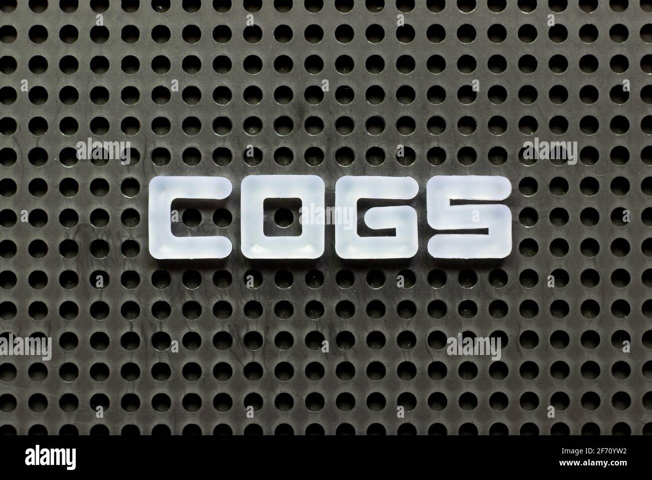 White color letter in word COGS (Abbreviation of Cost of goods sold) on ...