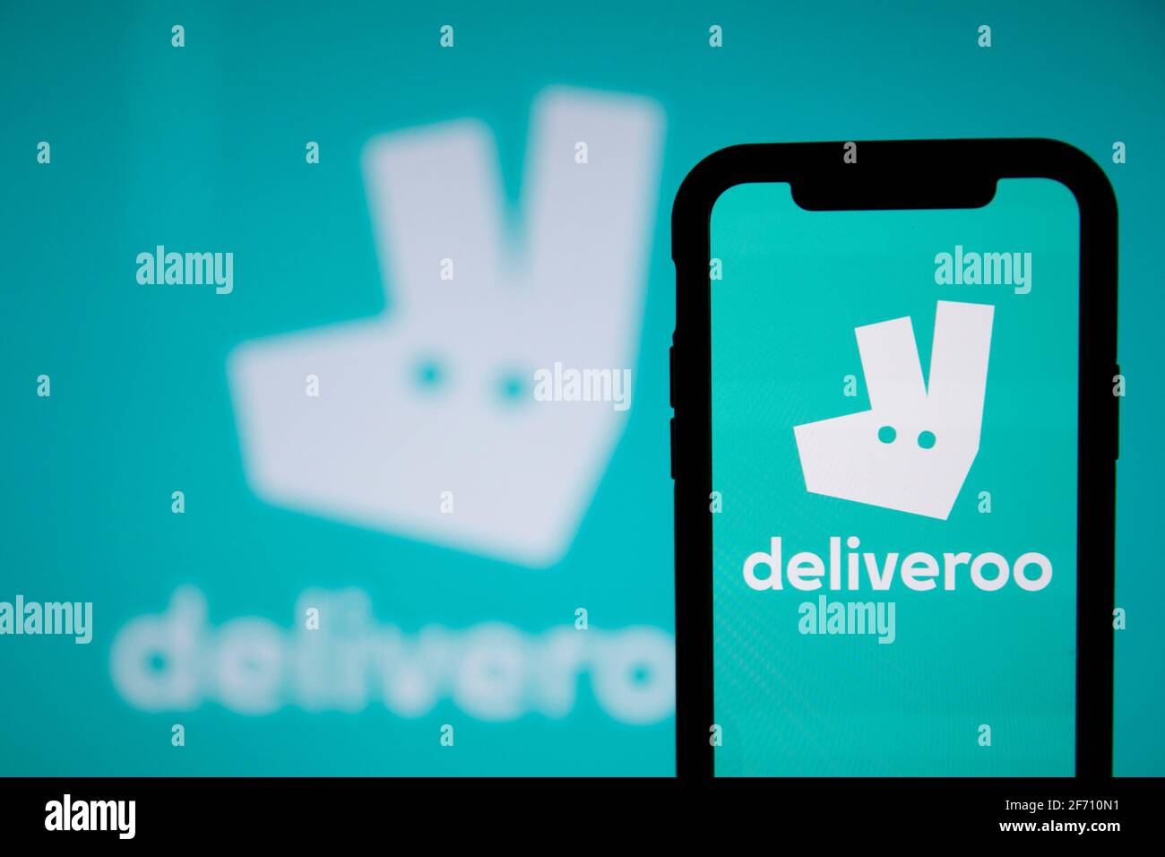 LONDON, UK - April 2021: Deliveroo takeaway delivery service logo on a ...
