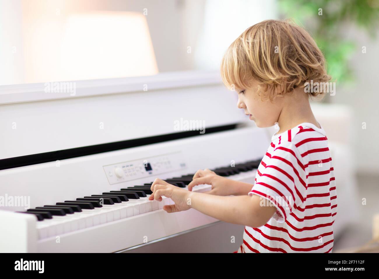 Child playing piano. Kids play music. Classical education for children ...