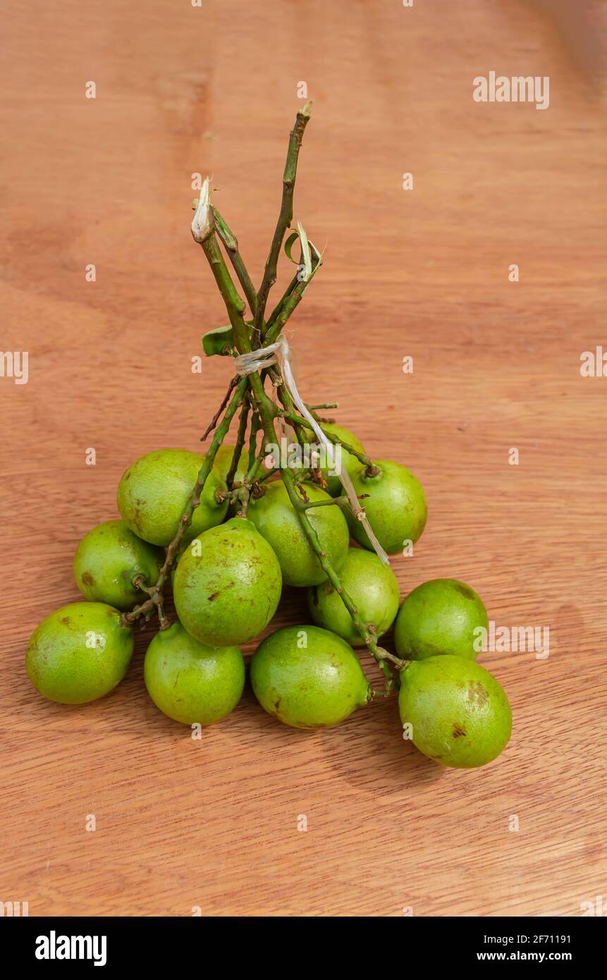 Mature Guinep On Board Background Stock Photo - Alamy