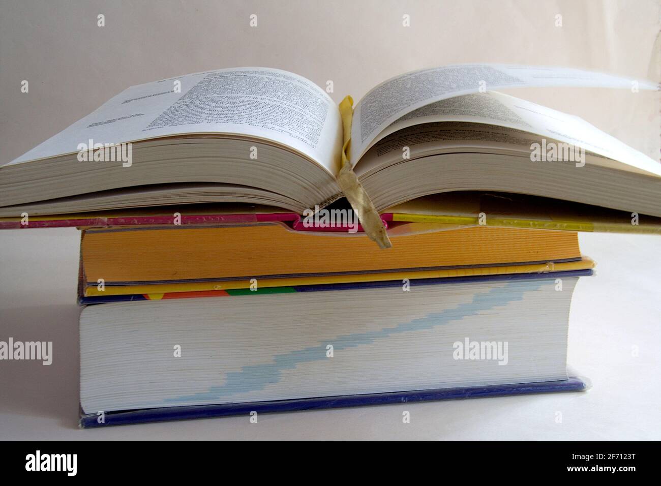 Open book with tag mark being used for reference in serous study Stock ...