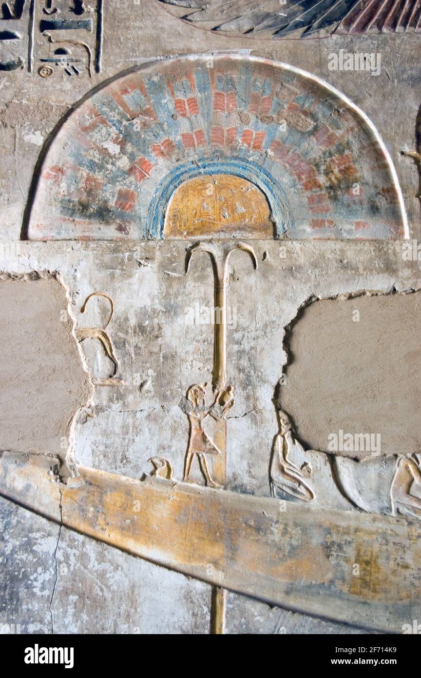 A coloured ancient Egyptian hieroglyphic carving showing a feather fan ...