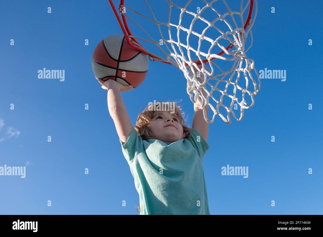 Basketball Slam Dunks of sporty kids basketball player. Close up image ...