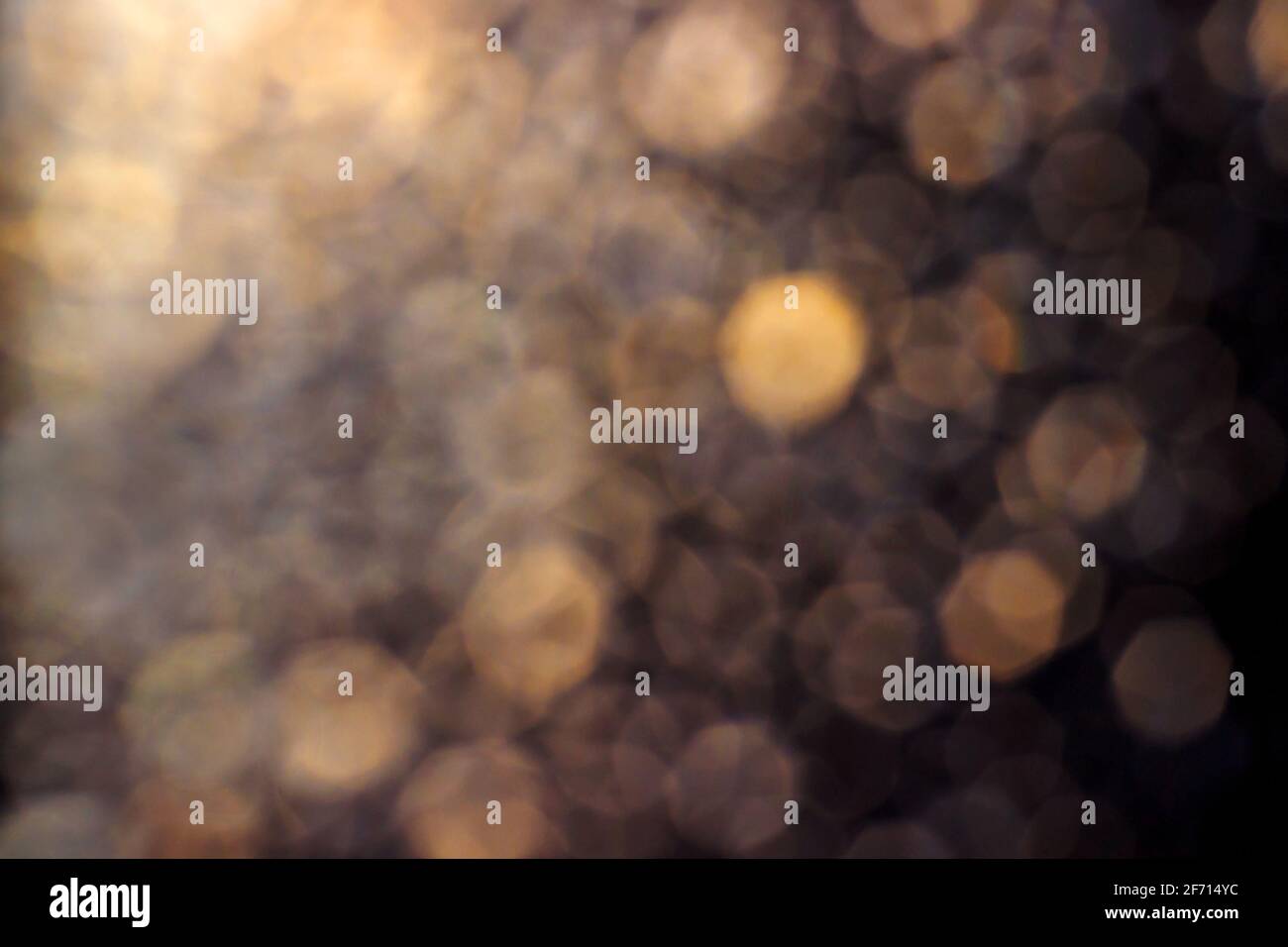 Abstract yellow-brown bokeh background in different shades of grey ...