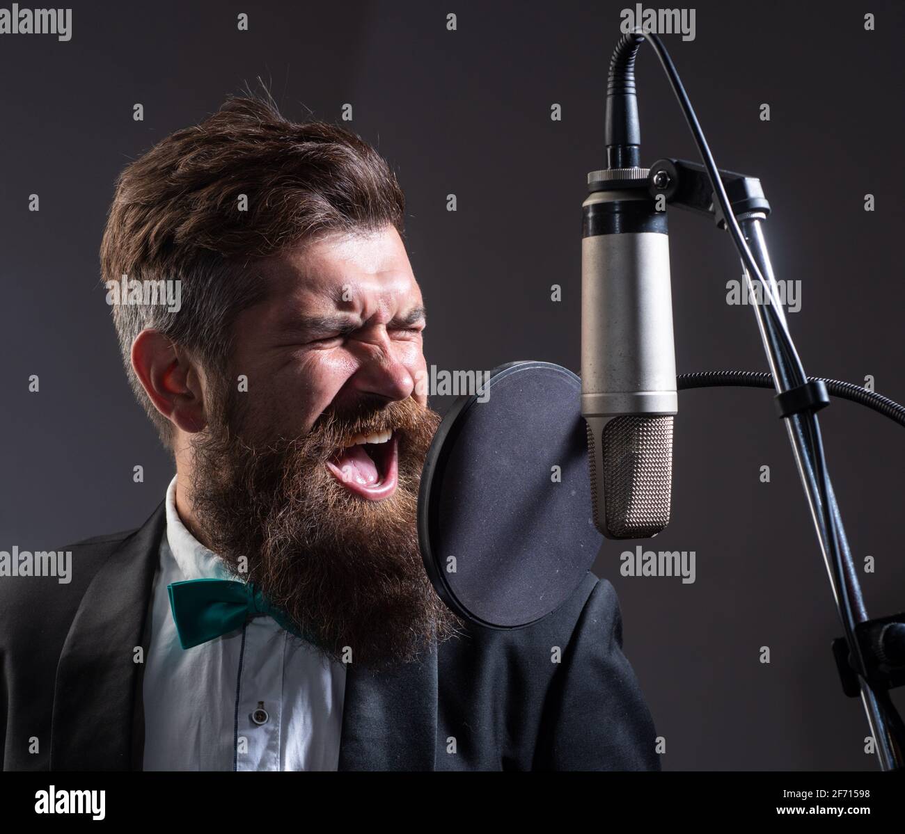 Karaoke singer. Man singing with music microphone. Classical music ...