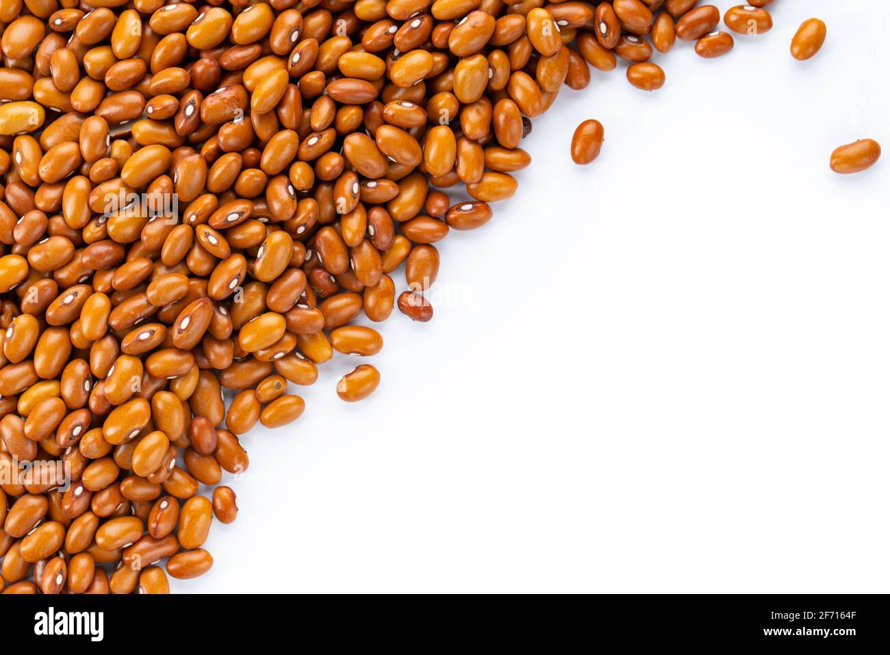 Dried orange beans on a white plate. Healthy food concept Stock Photo ...