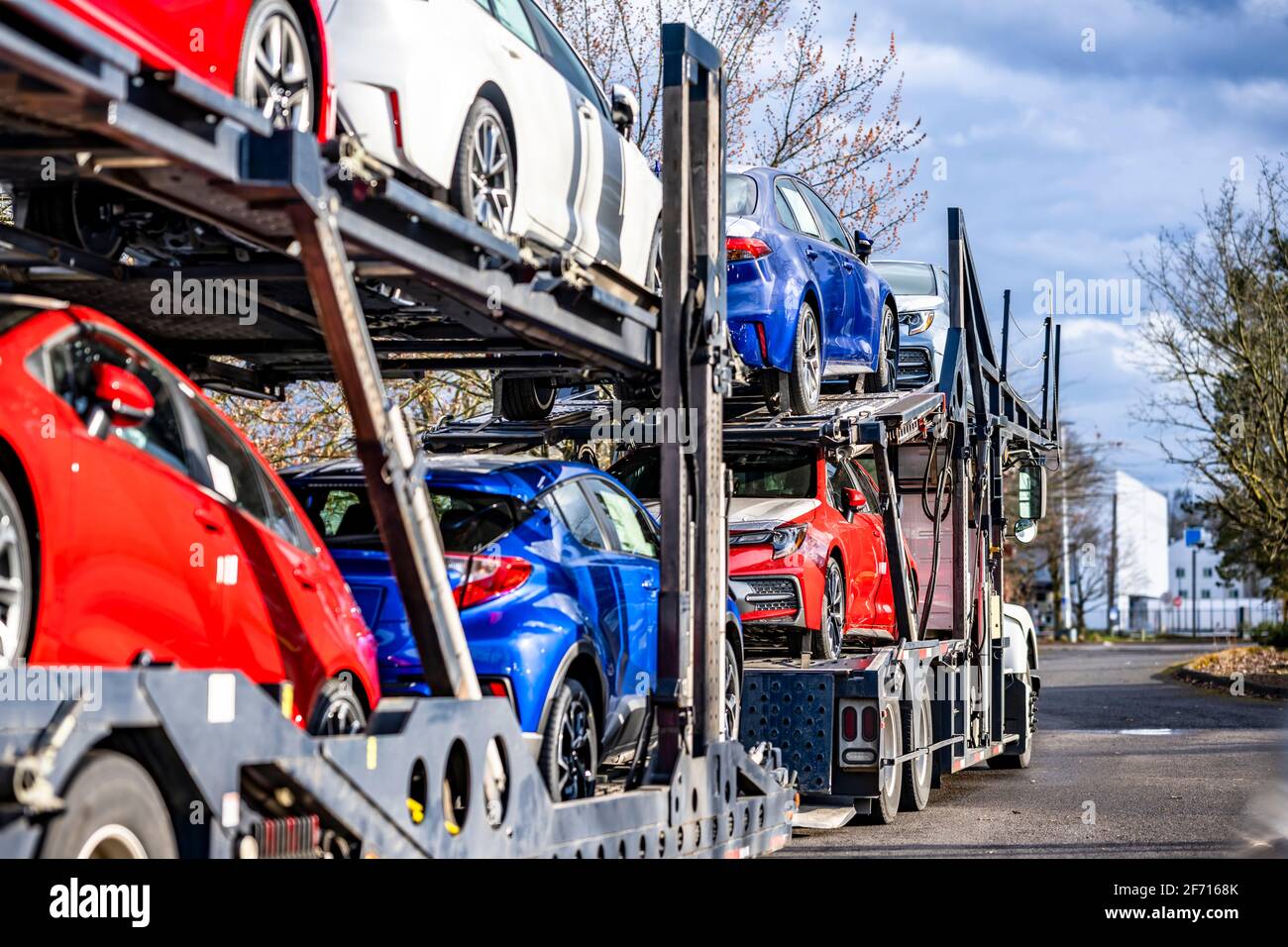 Classic Big rig industrial car hauler semi truck with two loaded double ...