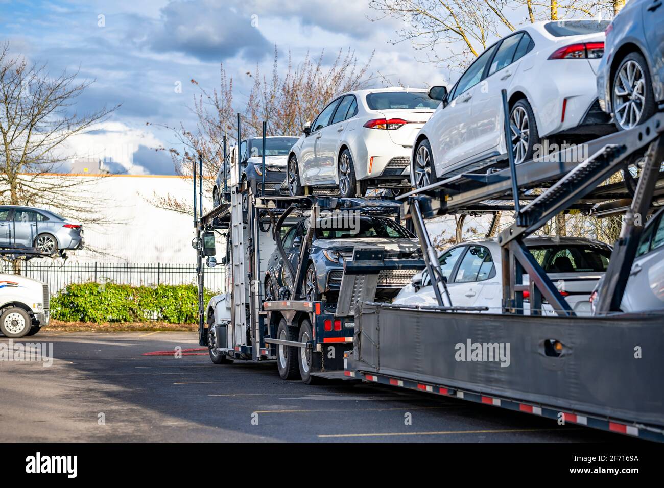 Classic Big rig industrial car hauler semi truck with two loaded double ...