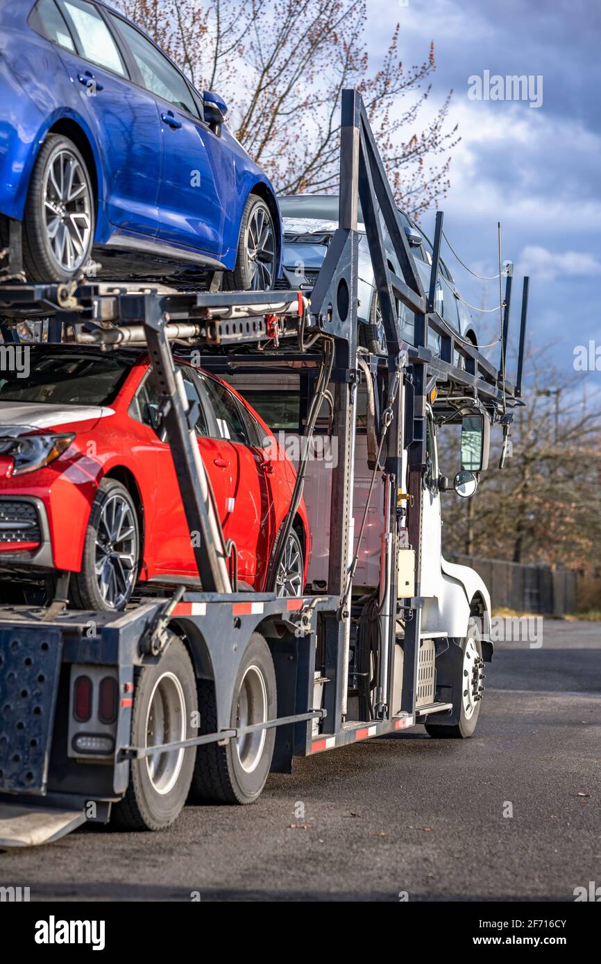 Classic Big rig industrial car hauler semi truck with loaded double ...