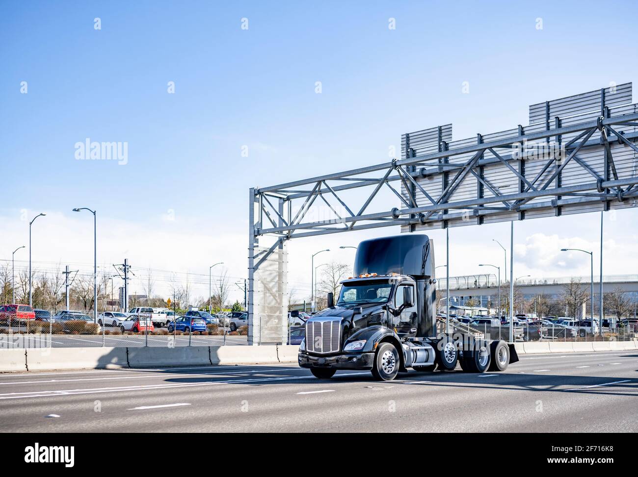 Powerful Big rig black day cab semi truck tractor without semi trailer ...