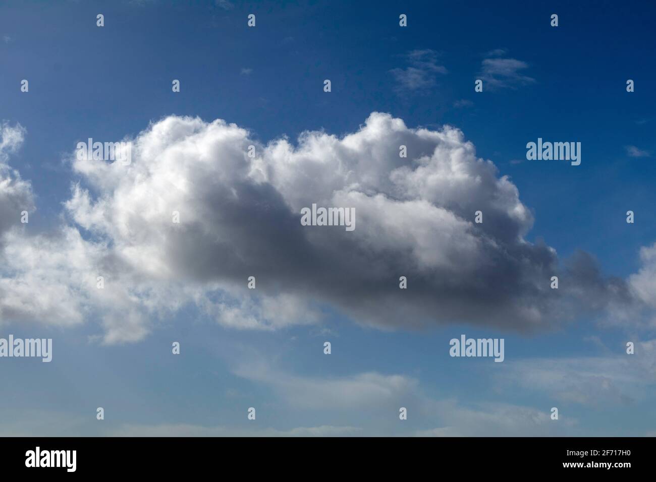 Clouds against a blue sky Stock Photo - Alamy