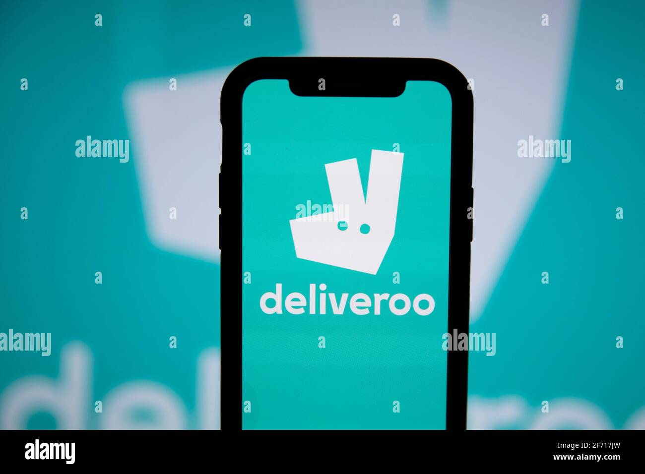 LONDON, UK - April 2021: Deliveroo takeaway delivery service logo on a ...