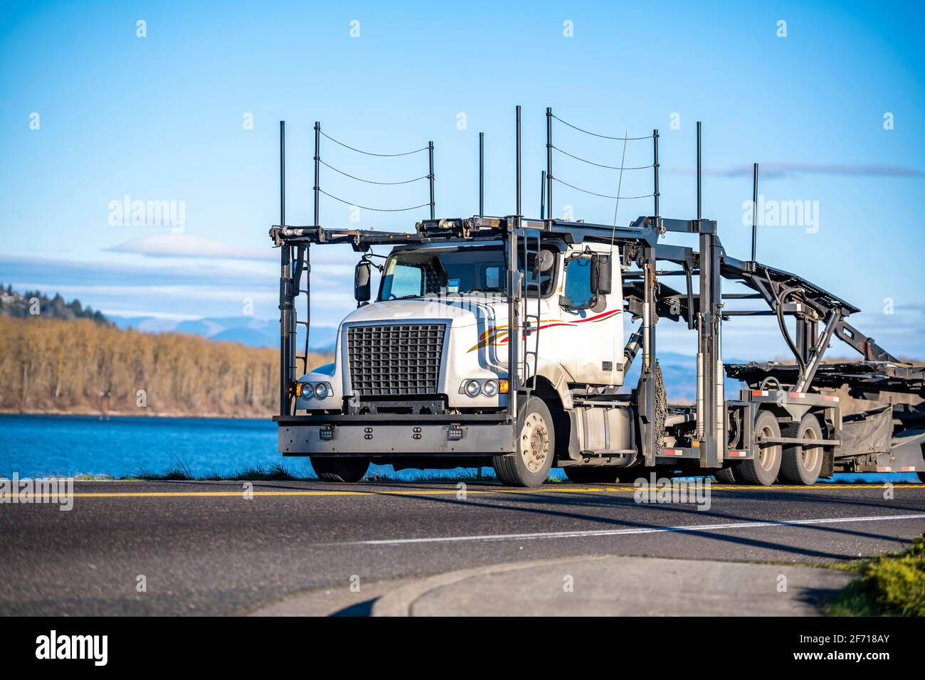 Classic Big rig industrial car hauler semi truck with empty double deck ...