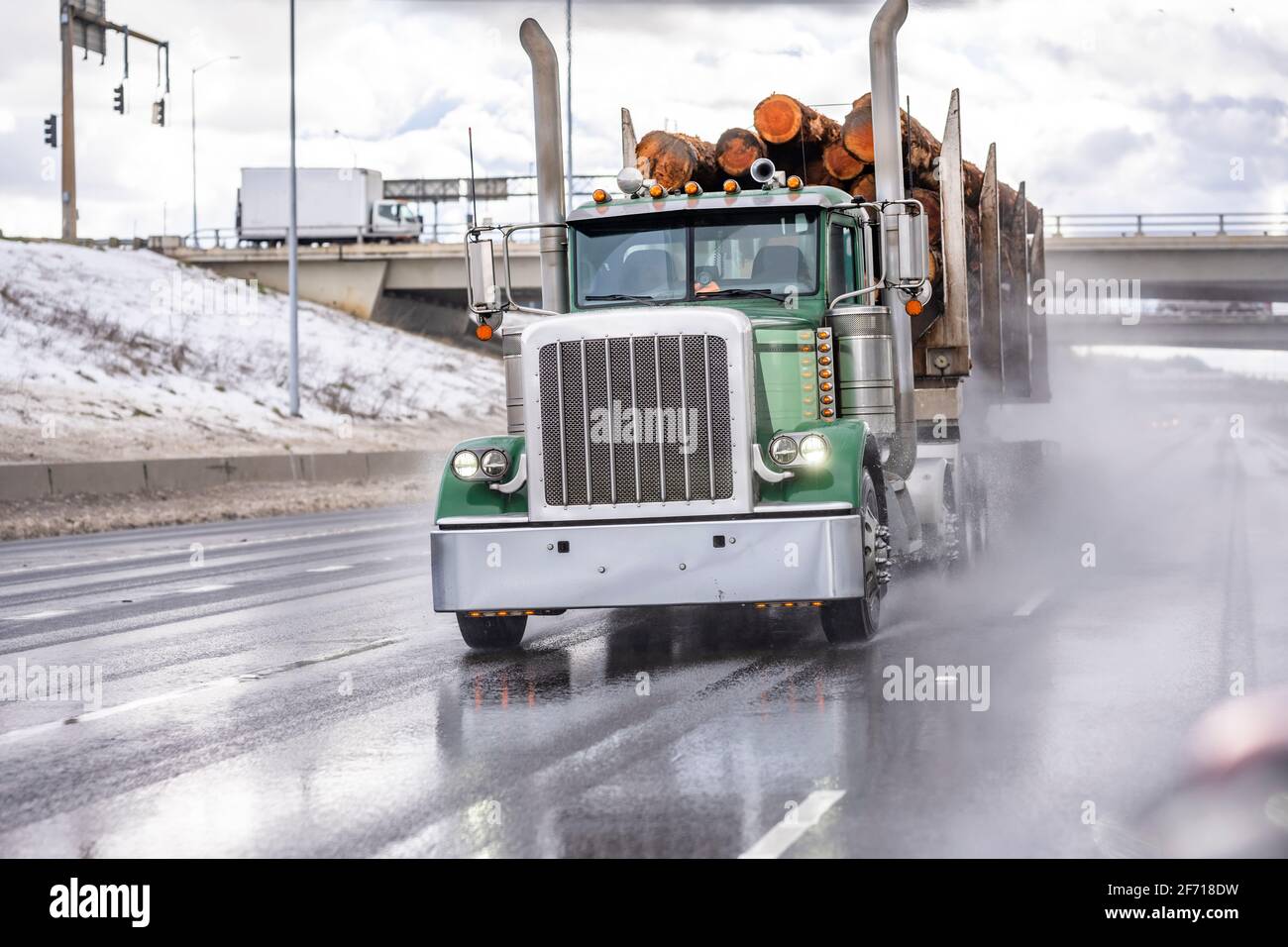 Industrial powerful big rig classic semi truck tractor transporting ...