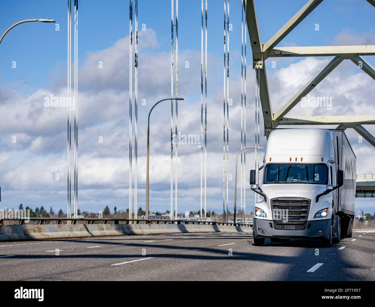 Big rig industrial powerful semi truck transporting commercial cargo in ...