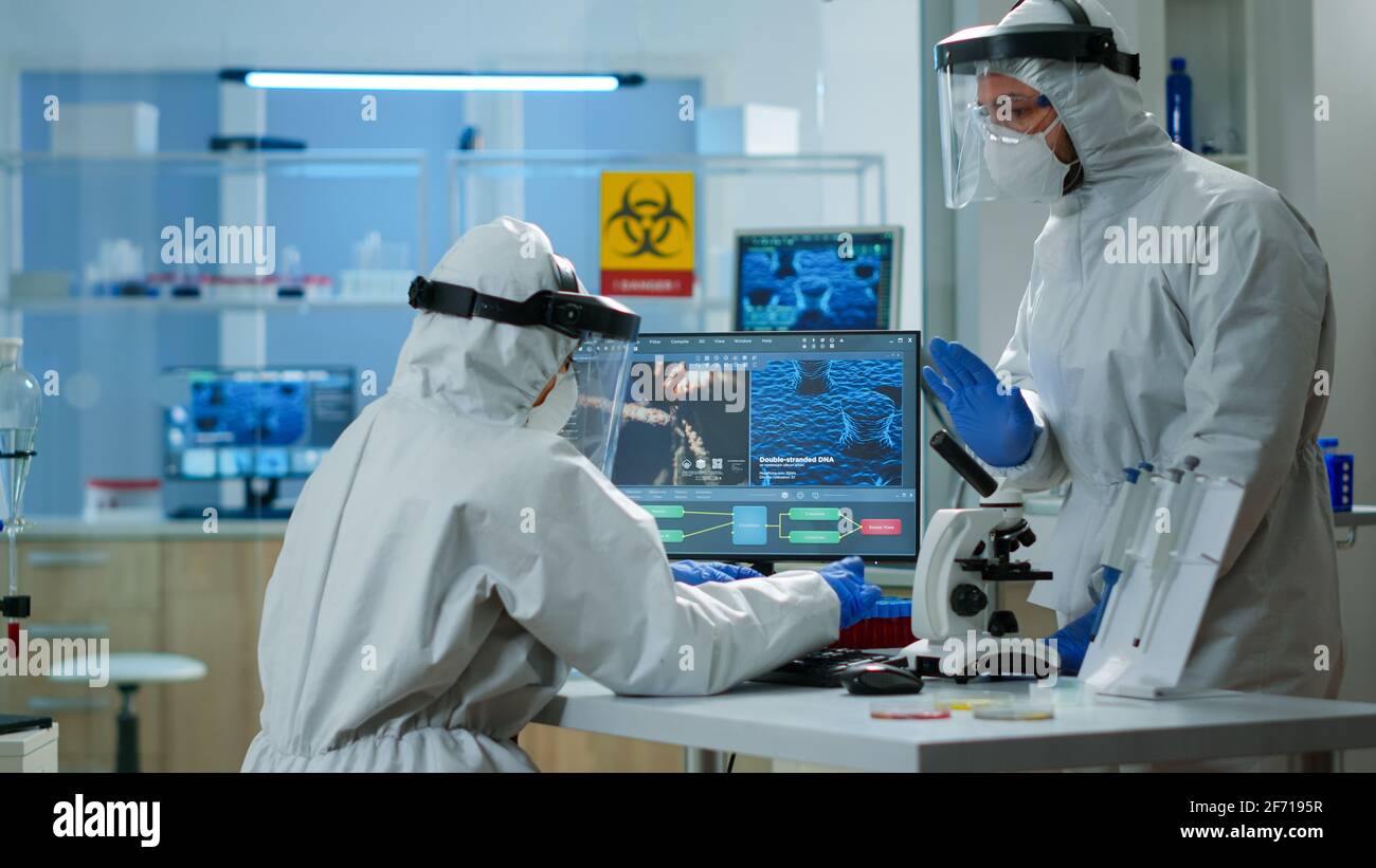 People ppe scientist checking hi-res stock photography and images - Alamy