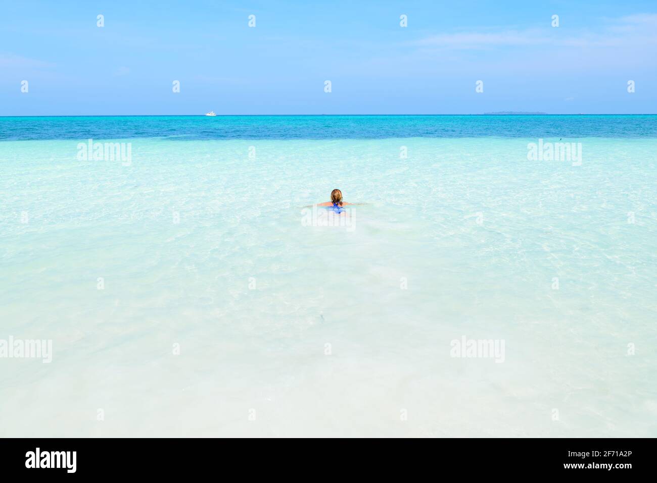 Woman swimming in caribbean sea turquoise transparent water. Tropical ...