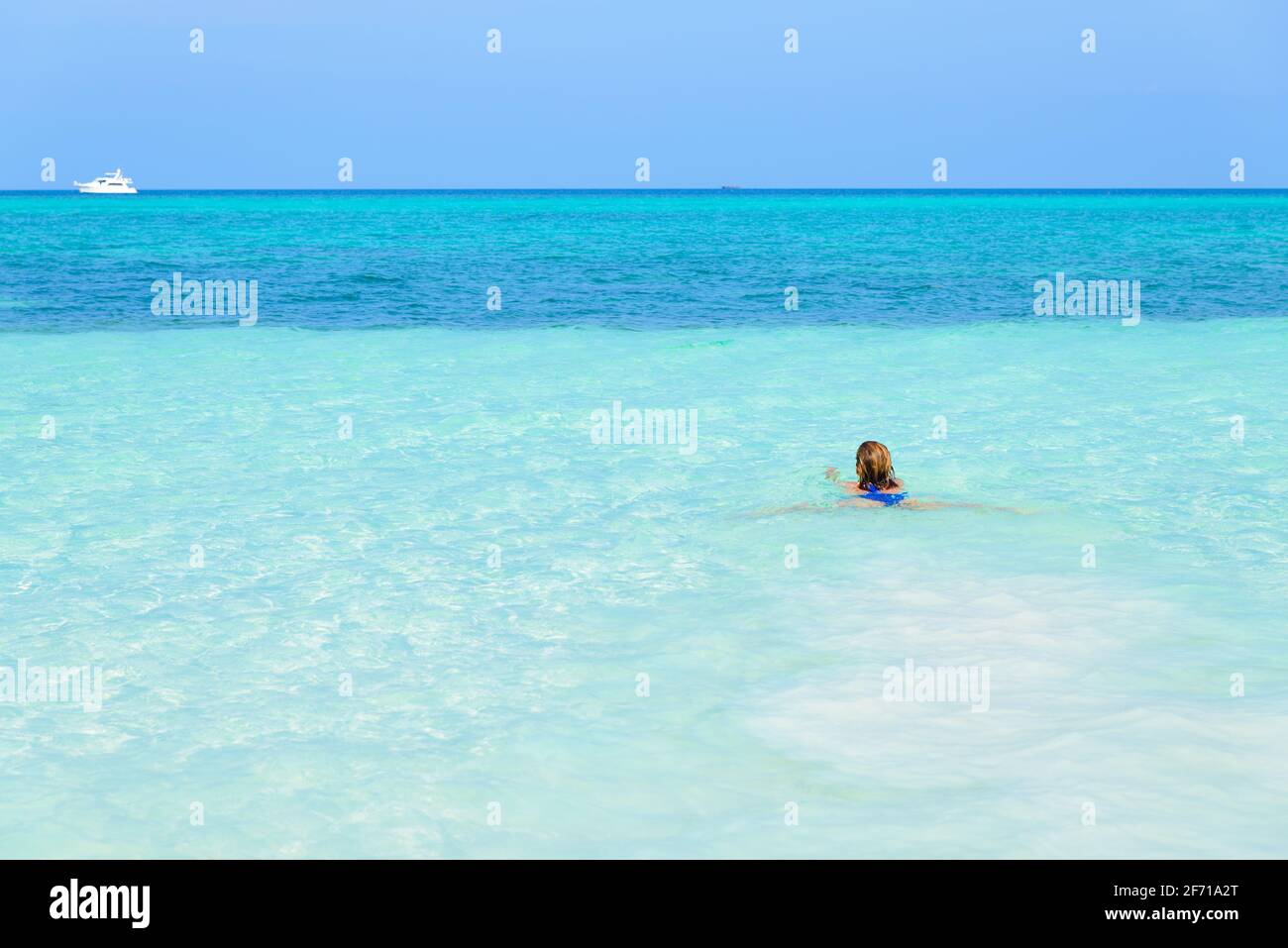 Woman swimming in caribbean sea turquoise transparent water. Tropical ...