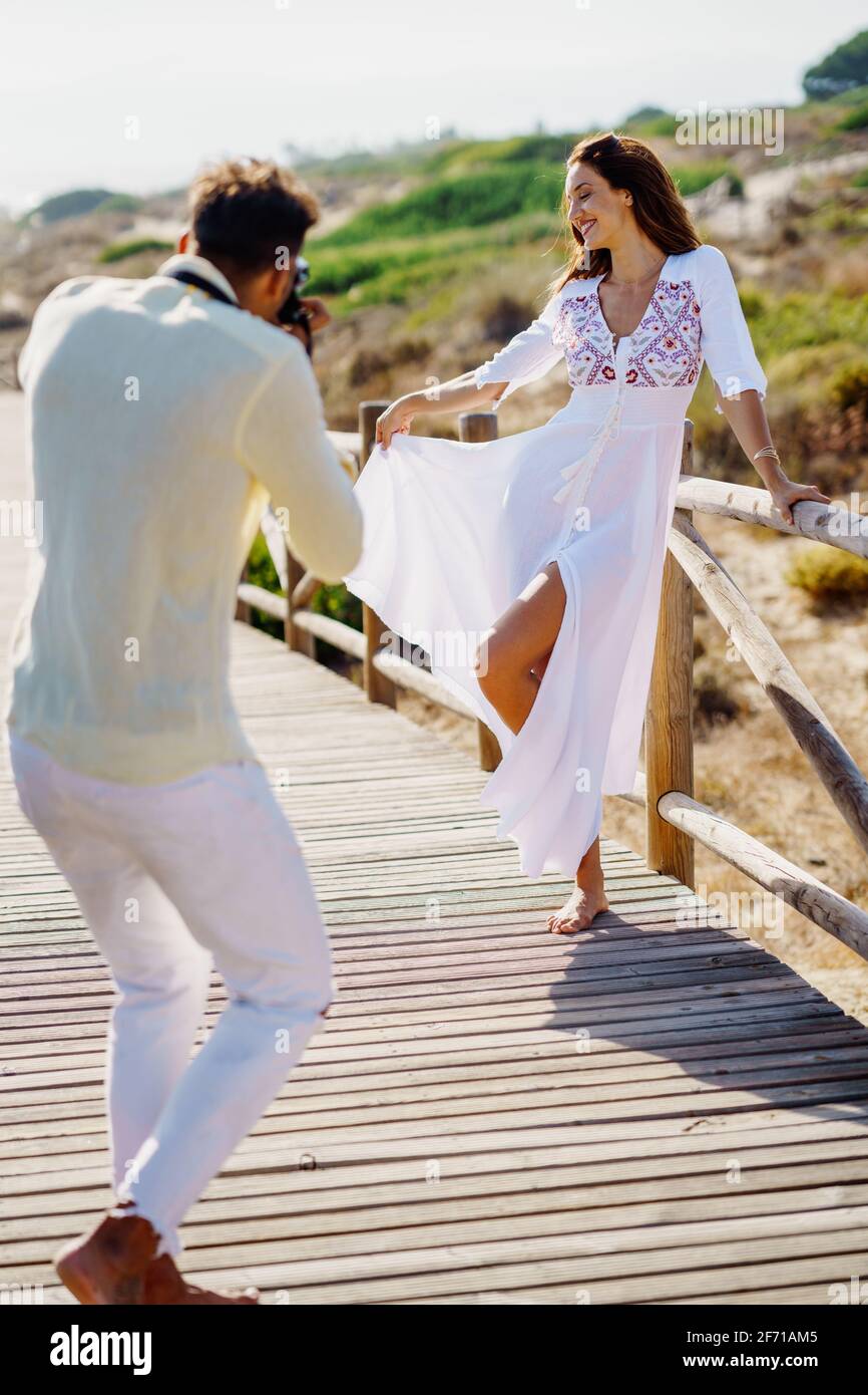 Man photographing his girlfriend hi-res stock photography and images ...