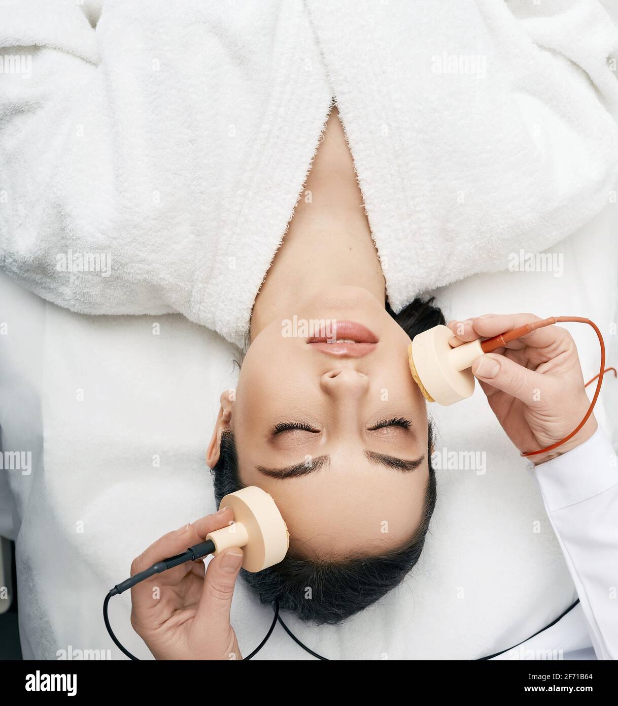 Beautiful woman receives microcurrent procedure for a facelift. Skin ...